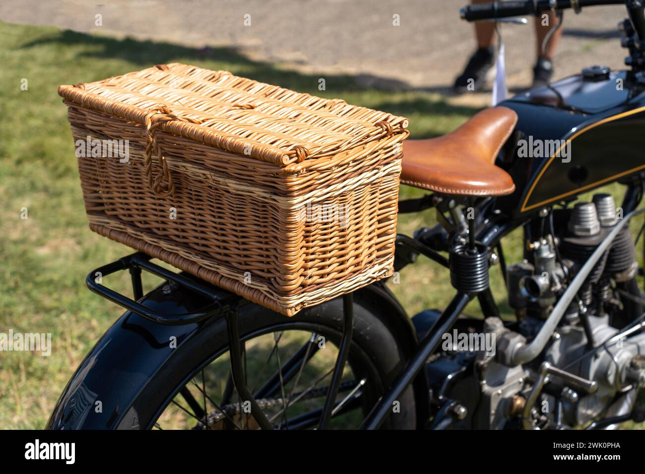 Old classic motorcycle with a wicker basket on the trunk Stock Photo ...