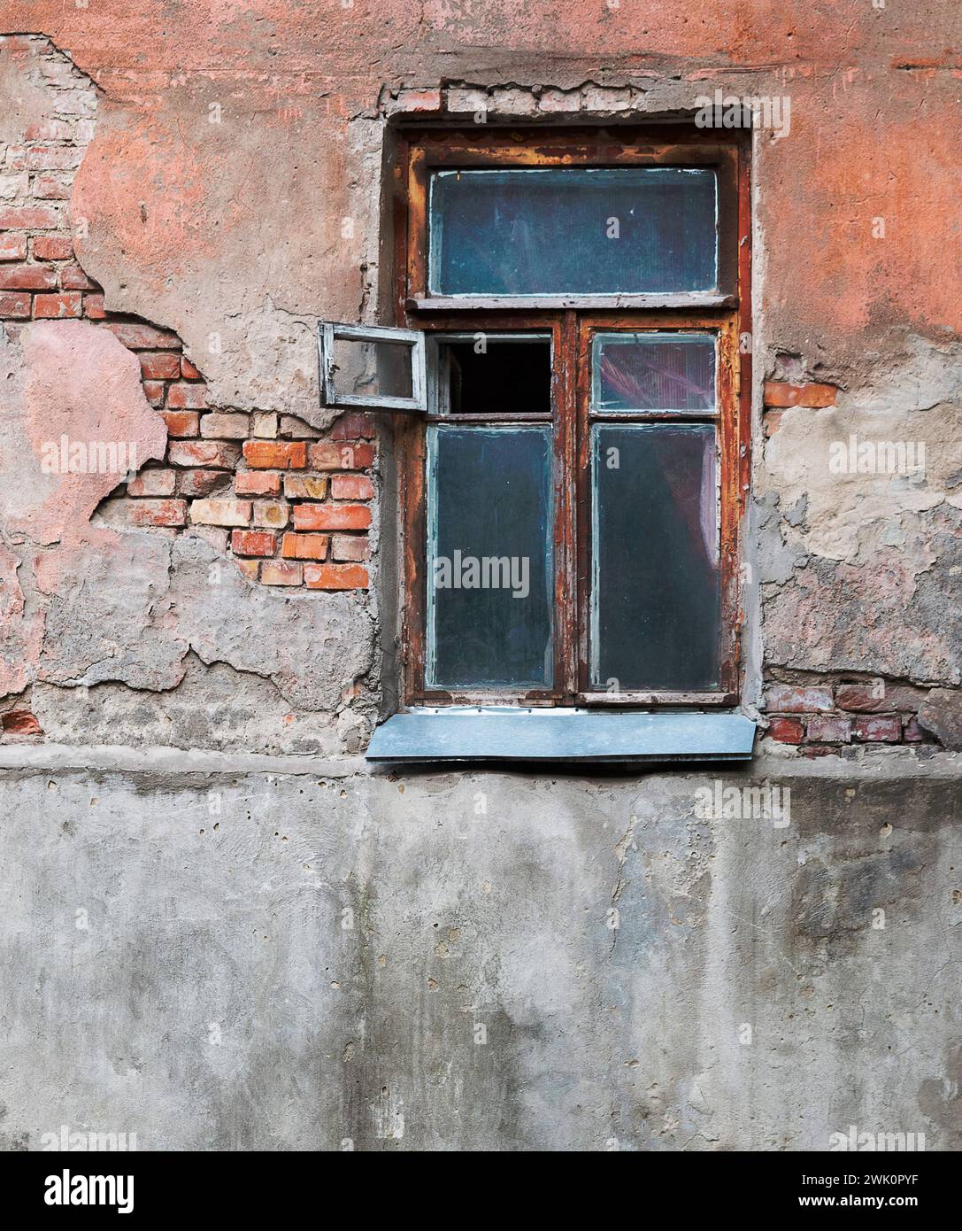 abandoned house in poor condition. cracked panes in the windows ...