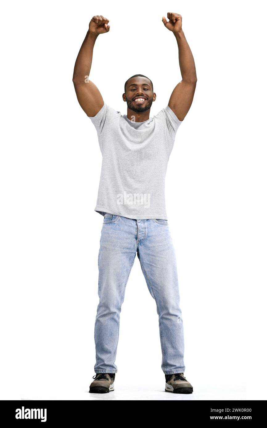 A man, full-length, on a white background, raised his hands up Stock ...