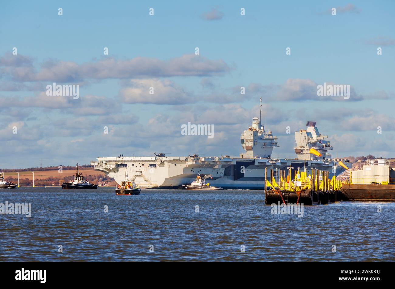 Tugs guide Queen Elizabeth-class aircraft carrier 'HMS Prince of Wales ...