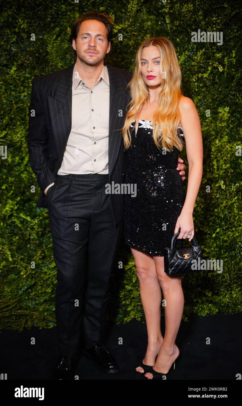 Tom Ackerley and Margot Robbie attend the Charles Finch and Chanel 2024 ...