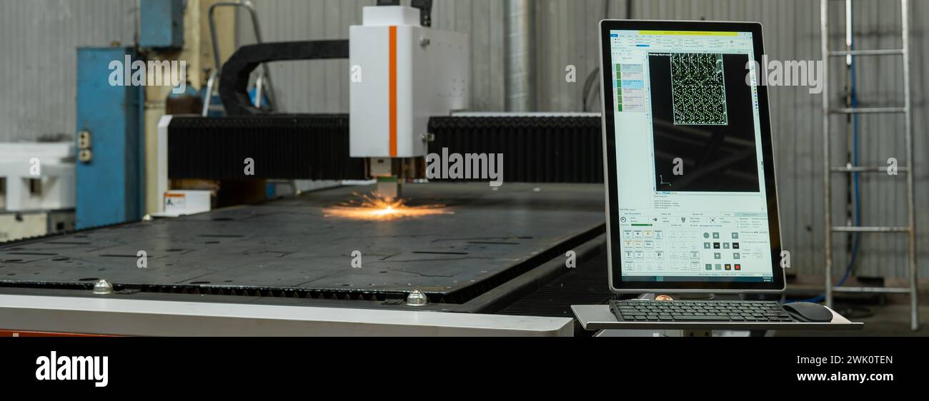 CNC machine. Laser cutting of metal. Sparks Stock Photo - Alamy