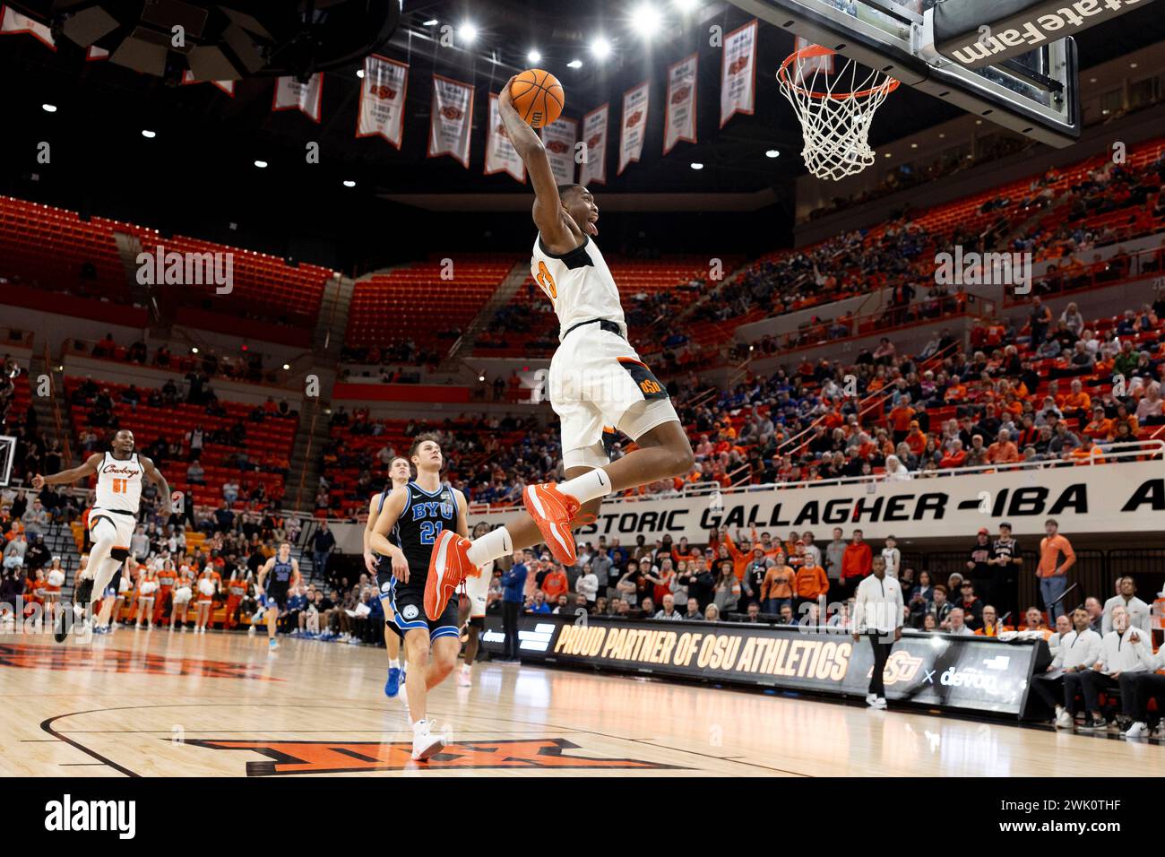 Oklahoma State center Brandon Garrison (23) goes up for a dunk in the ...