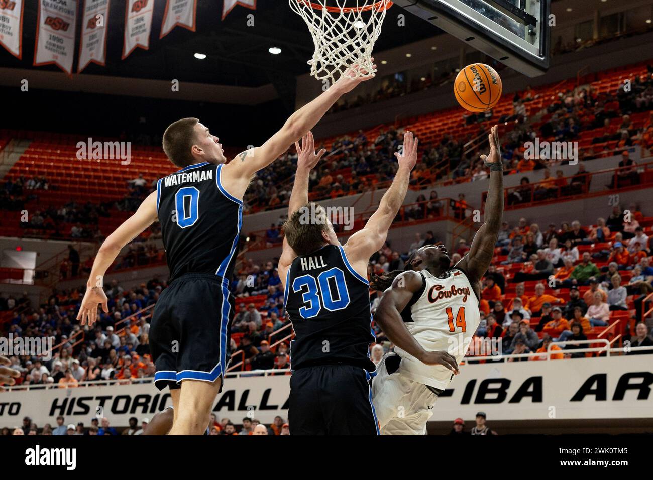 Oklahoma State guard Jamyron Keller (14) shoots the ball around BYU ...