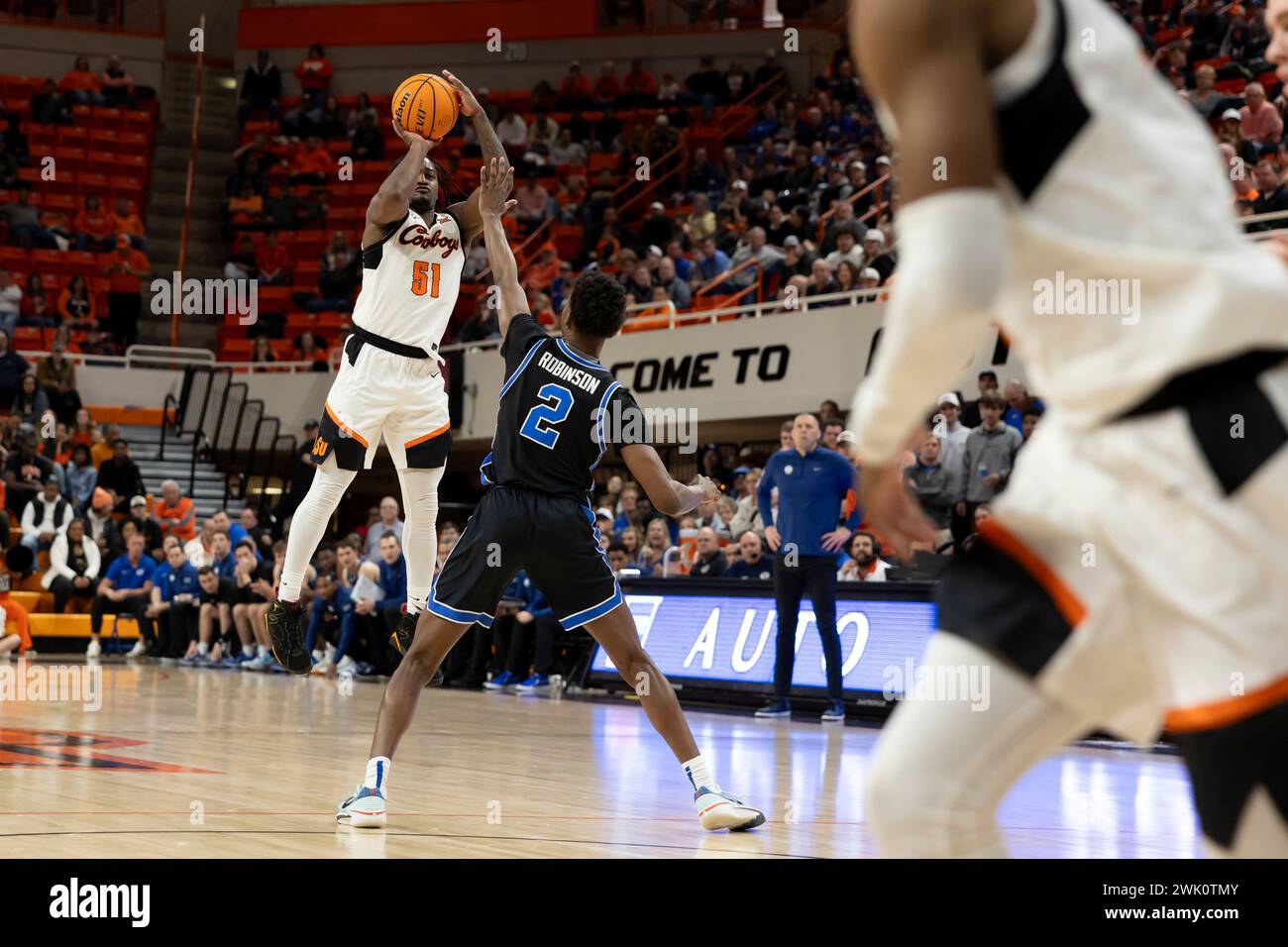 Oklahoma State guard John-Michael Wright (51) shoots over BYU guard ...