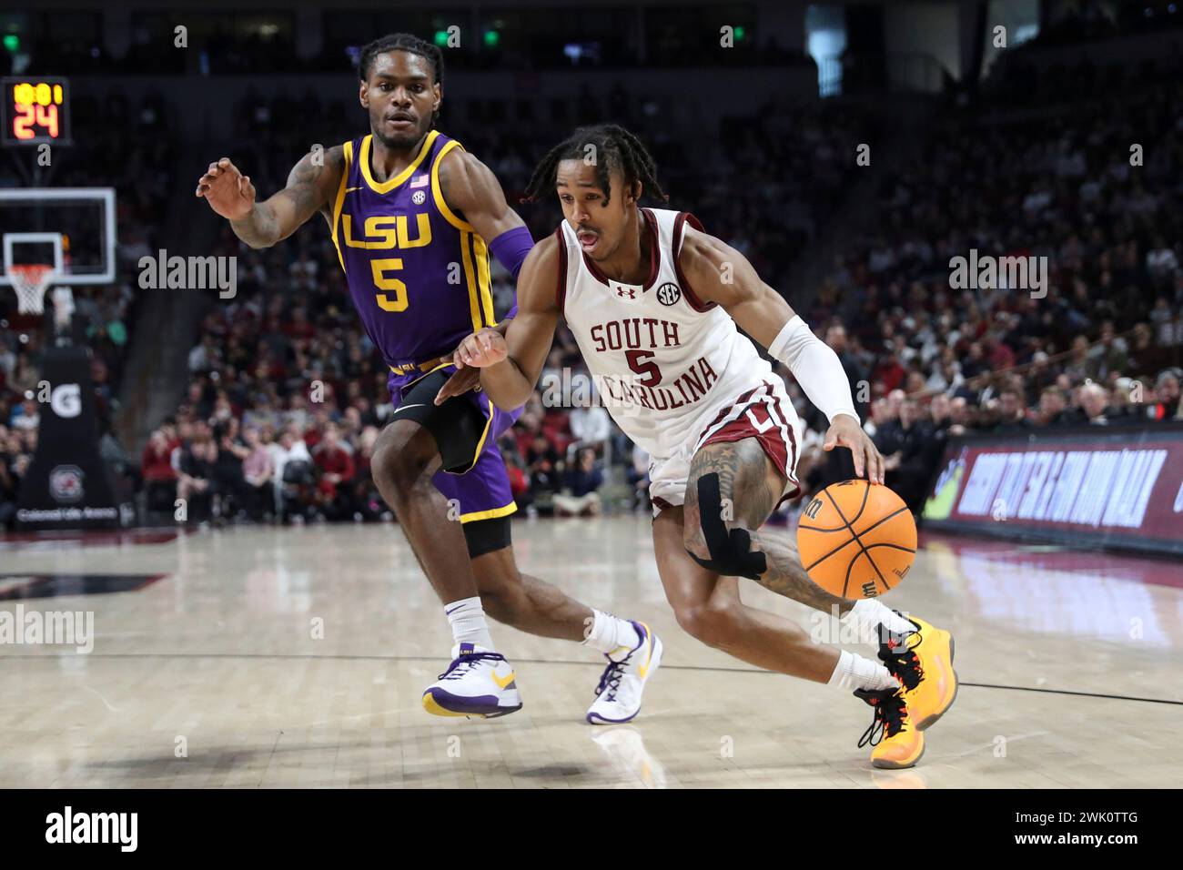South Carolina guard Meechie Johnson, front, drives to the basket past ...