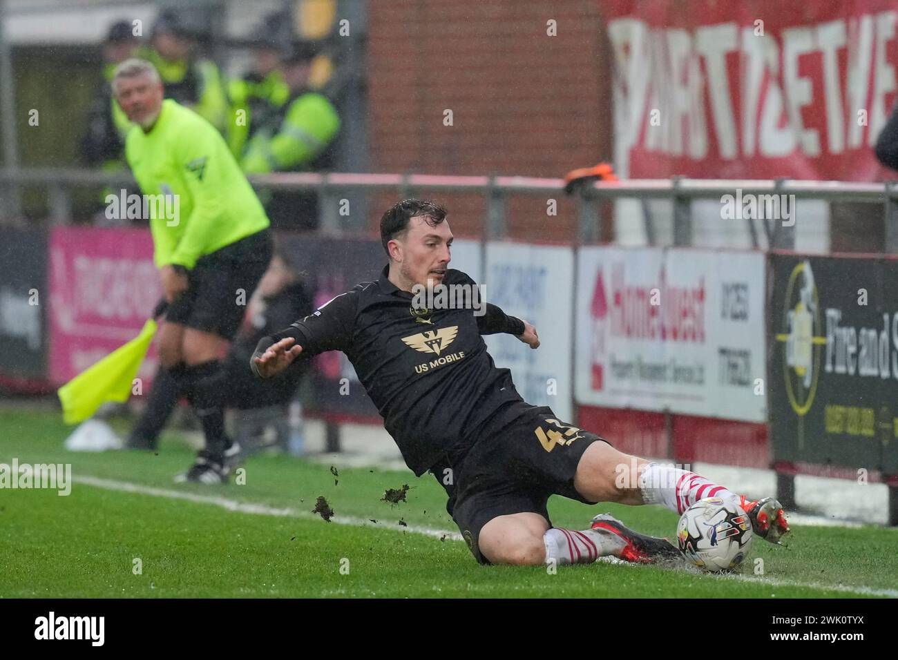 Josh Earl of Barnsley stretches to keep the ball in play during the Sky ...
