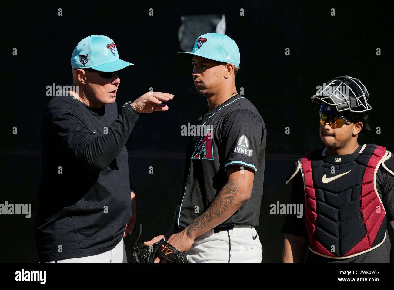 Arizona Diamondbacks pitching coach Brent Strom, left, talks with Diamondbacks relief pitcher ...