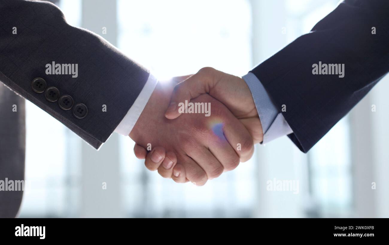 Handshake after a deal, successful deal, teamwork Stock Photo - Alamy