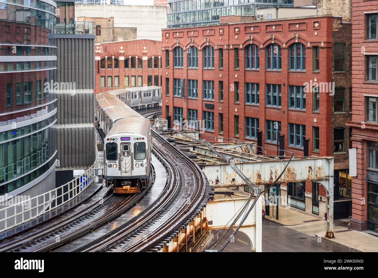 Chicago elevated commuter train on winding tracks in downtown on a ...