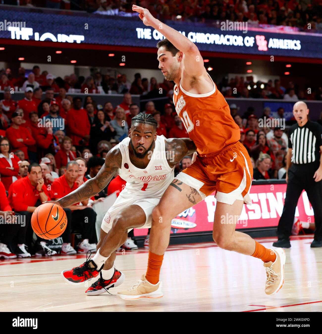 February 17, 2024: Houston guard Jamal Shead (1) moves the ball past ...