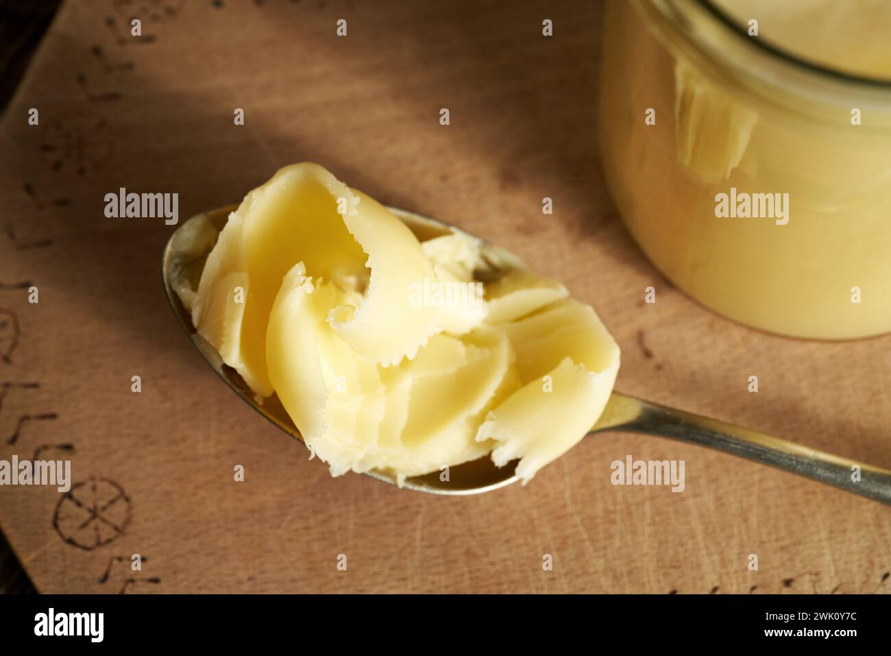 Jar of ghee with spoon hi-res stock photography and images - Alamy