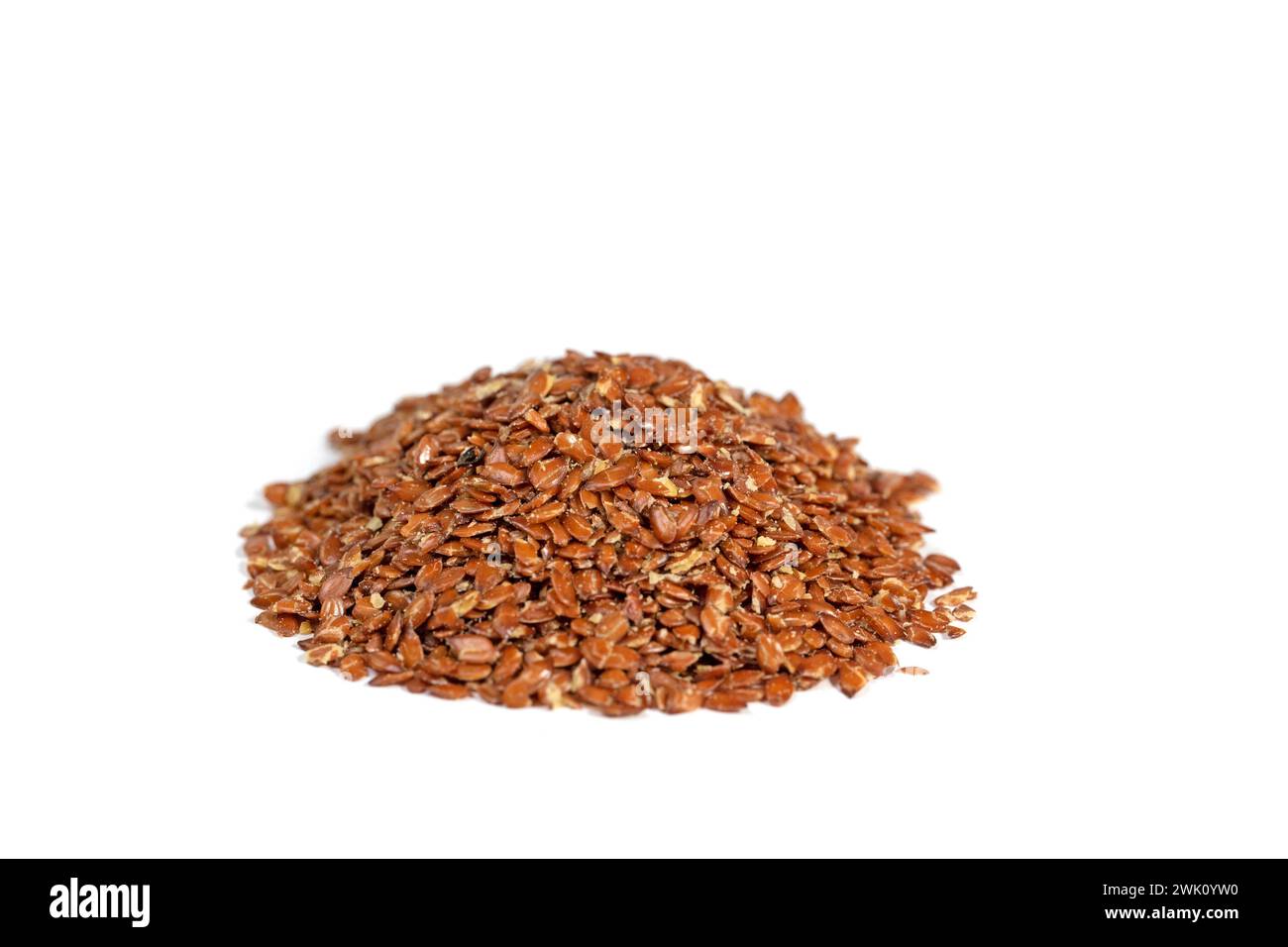 Crushed linseed against a white background Stock Photo - Alamy