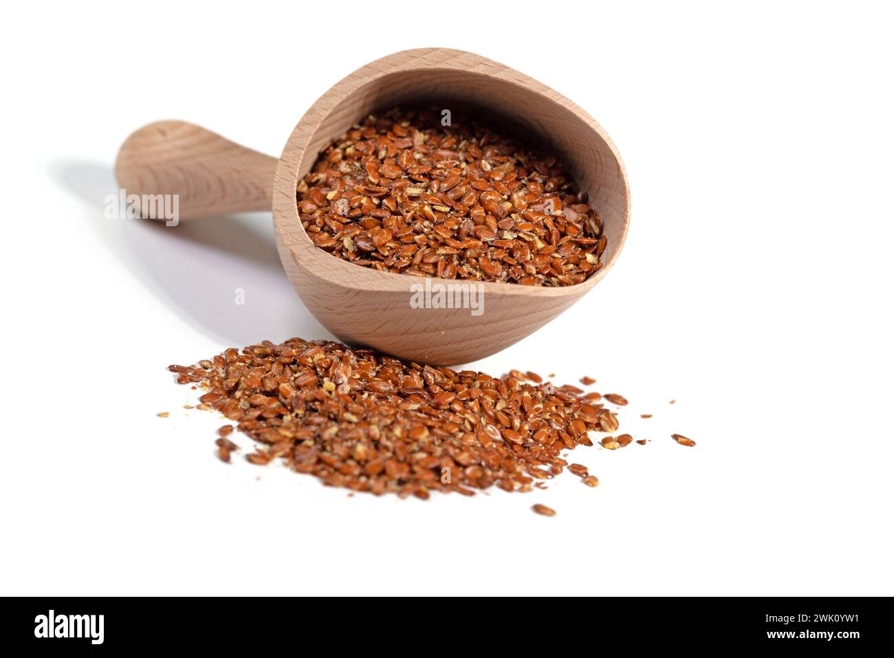 Crushed linseed against a white background Stock Photo - Alamy