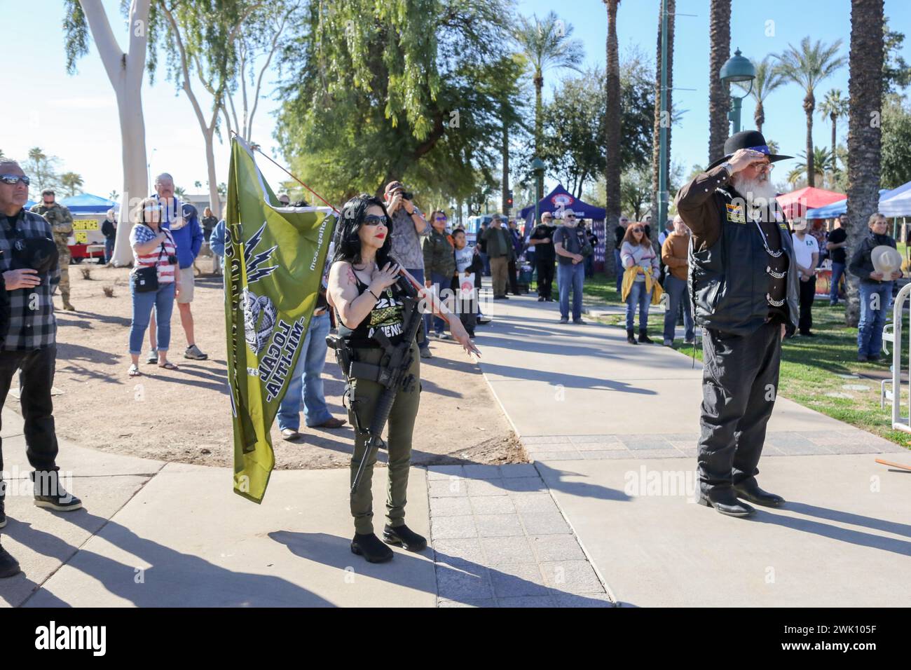 People listen in reverence during the Pledge of Allegiance at Arizona's ...
