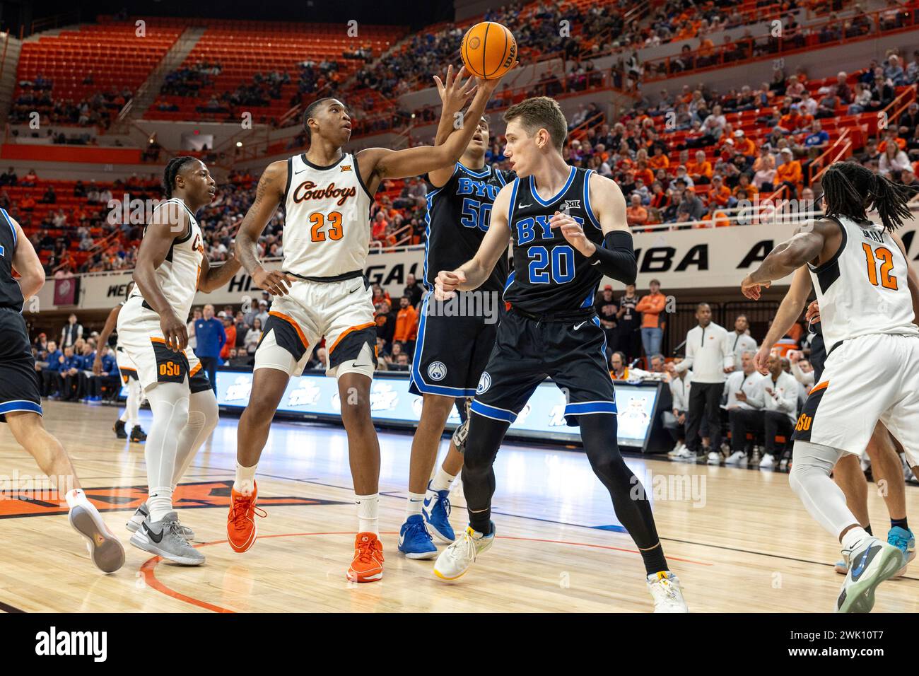 Oklahoma State center Brandon Garrison (23), BYU center Aly Khalifa (50 ...