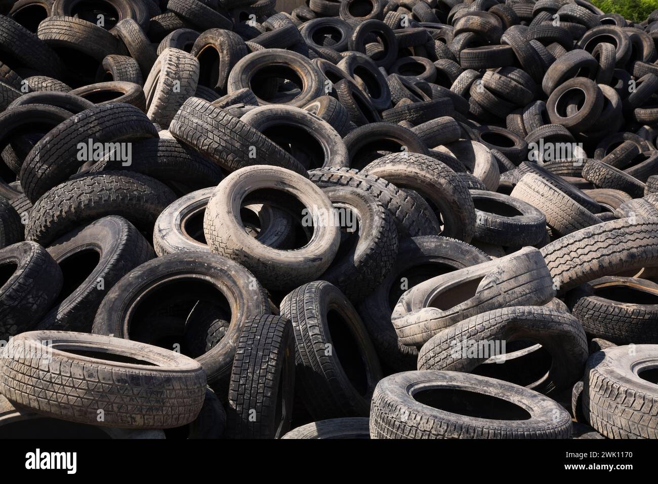 Pile of discarded car and truck tires at recycling yard Stock Photo - Alamy