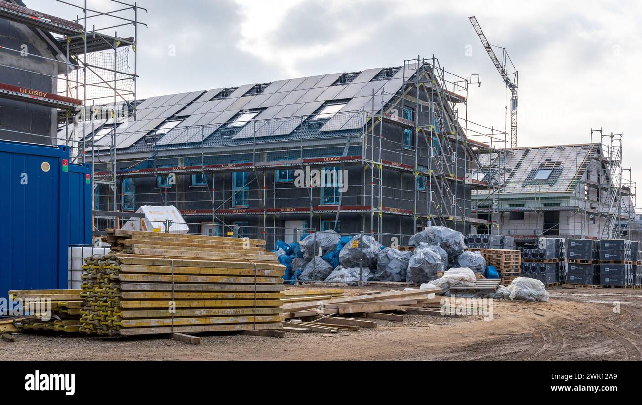 Photo of an empty building under construction with piles of wood Stock ...