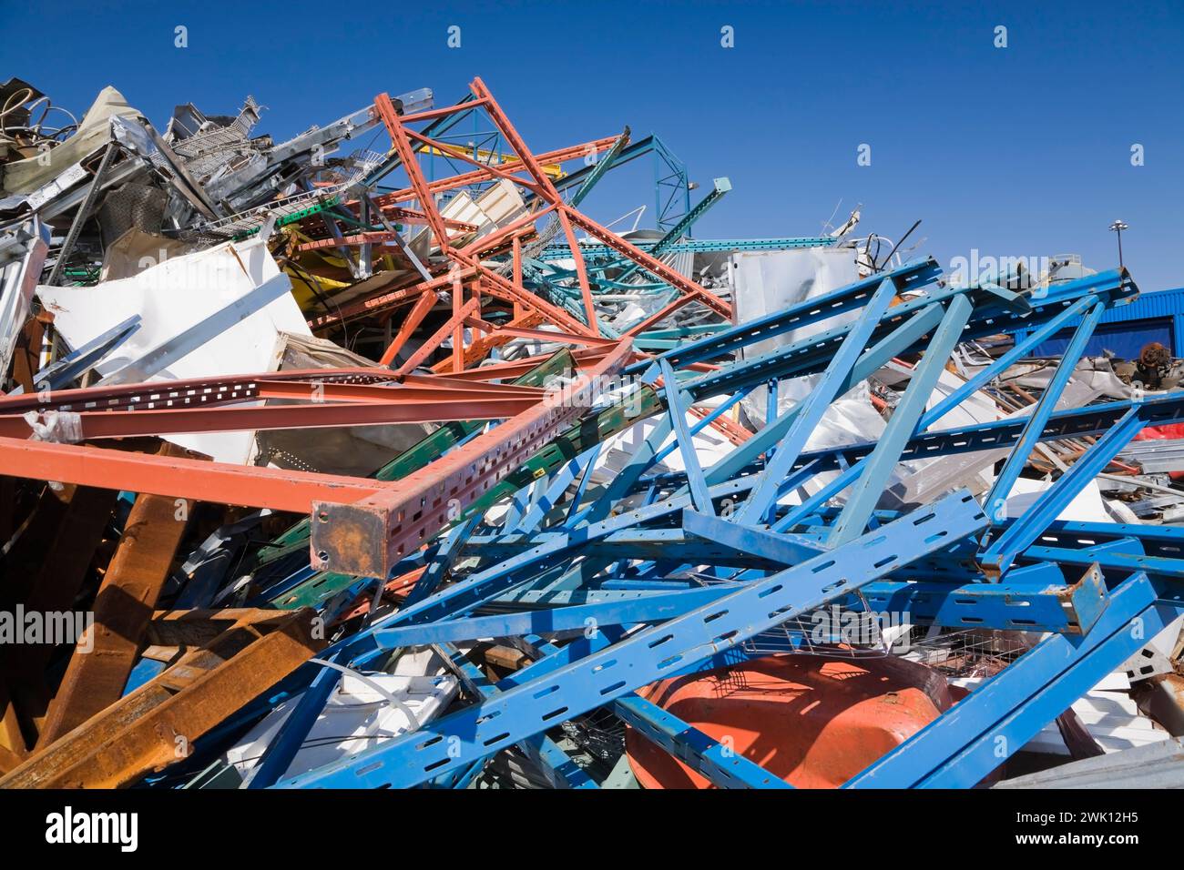 Pile of discarded steel racks and shelves at scrap metal recycling ...