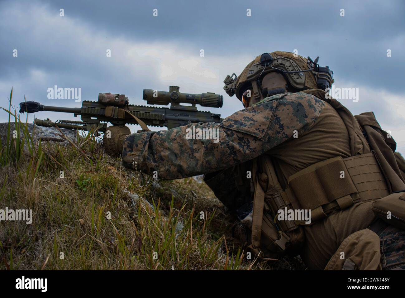 A U.S. Marine with Battalion Landing Team 1/1, 31st Marine Expeditionary Unit, fires an M27 ...