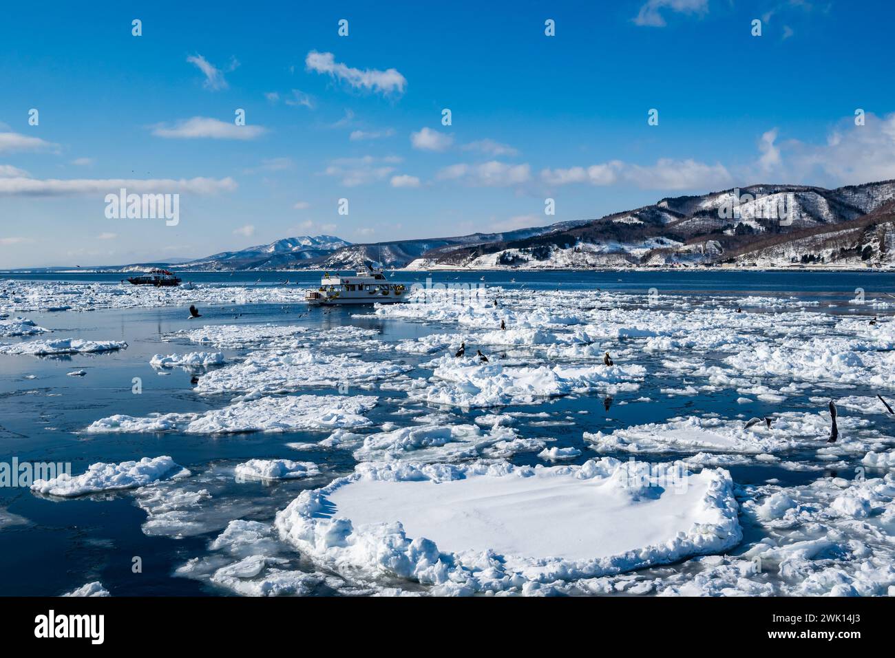Tour boats bringing tourists to enjoy the winter scenery. Rausu ...