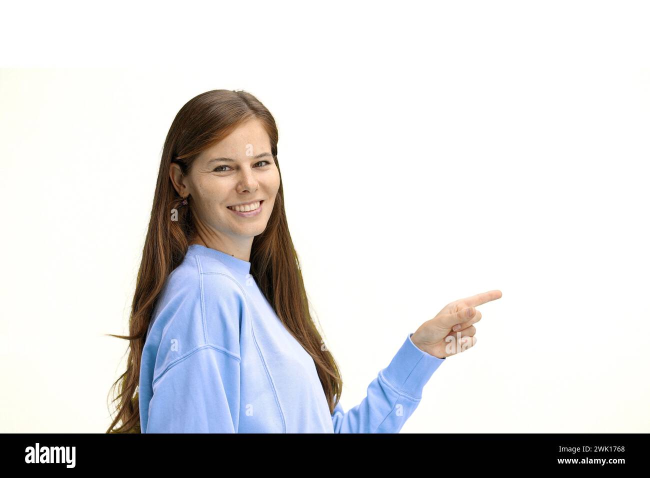 Lady pointing on something white hi-res stock photography and images ...