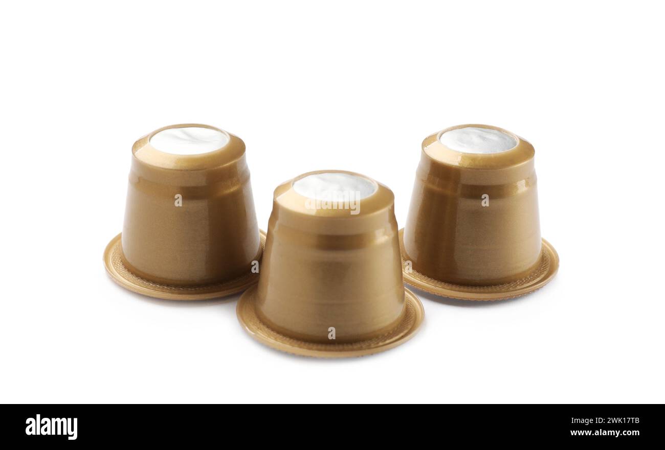 Three plastic coffee capsules isolated on white Stock Photo - Alamy