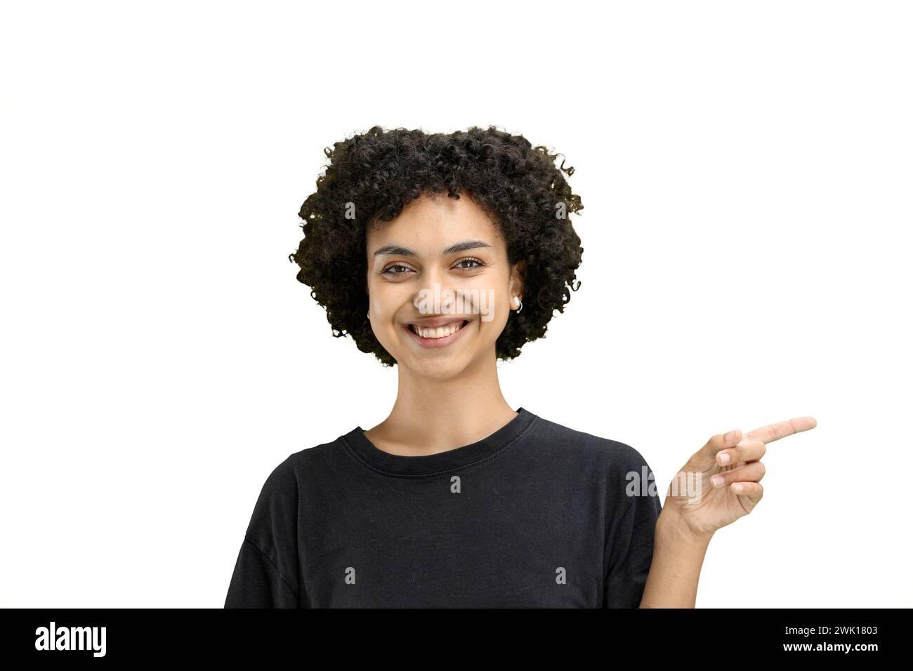 A woman, close-up, on a white background, points to the side Stock ...
