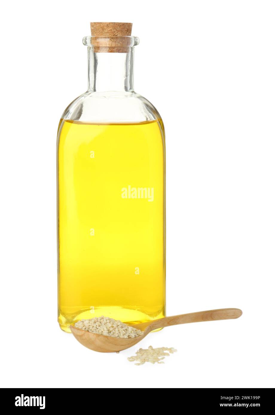 Vegetable fats. Sesame oil in glass bottle and seeds isolated on white ...