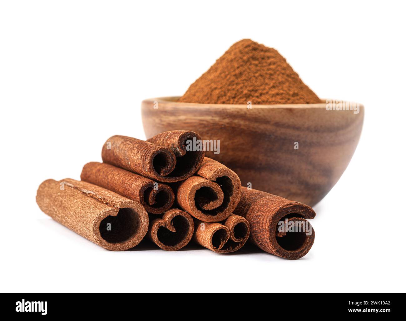 Dry aromatic cinnamon sticks and powder isolated on white Stock Photo ...