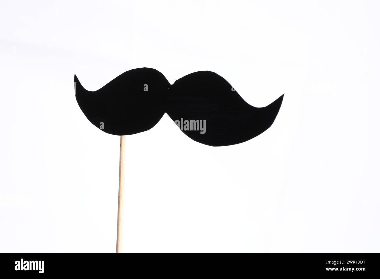 Fake paper mustache party prop against white background Stock Photo - Alamy