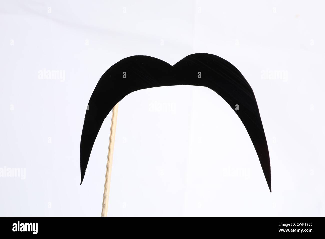 Fake paper mustache party prop against white background Stock Photo - Alamy