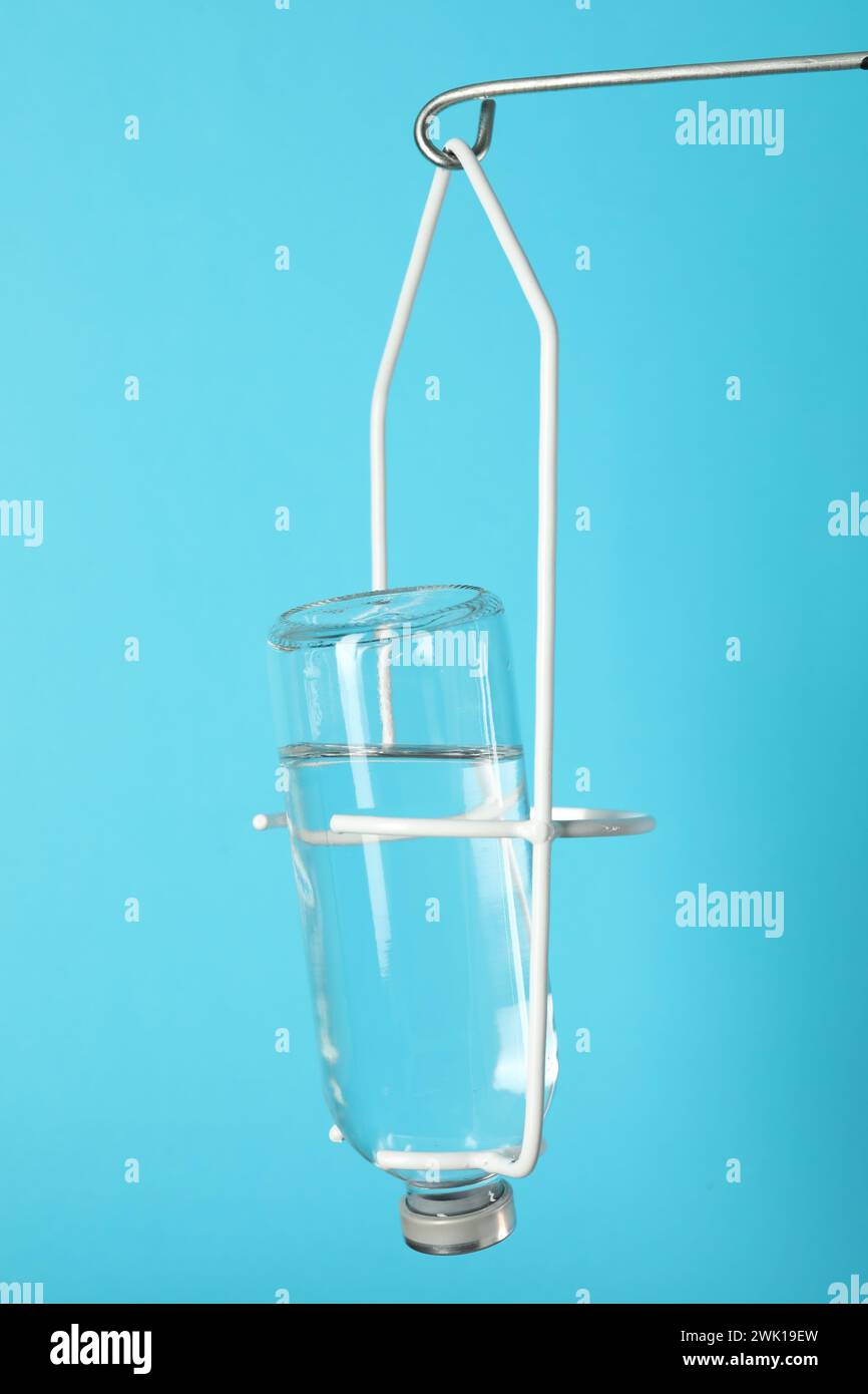 IV infusion set on light blue background Stock Photo - Alamy