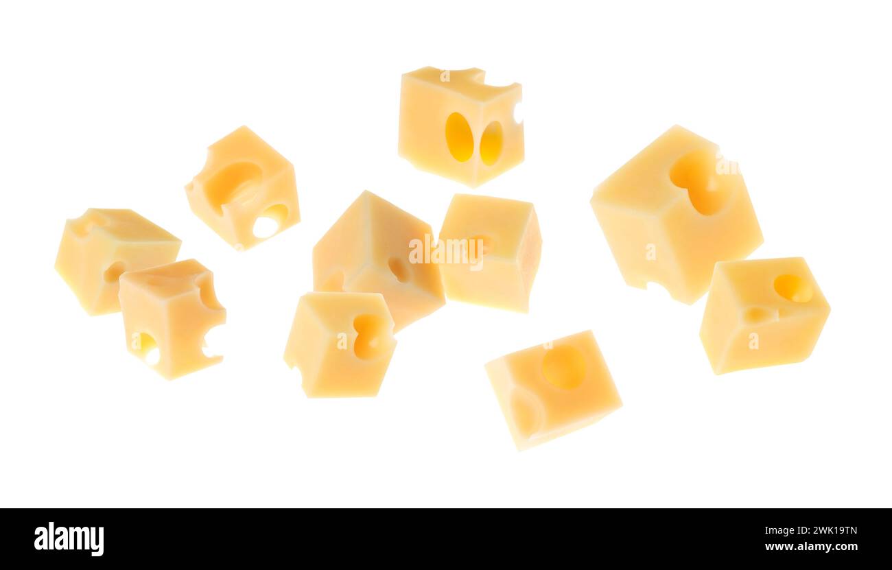 Pieces of cheese flying on white background Stock Photo - Alamy