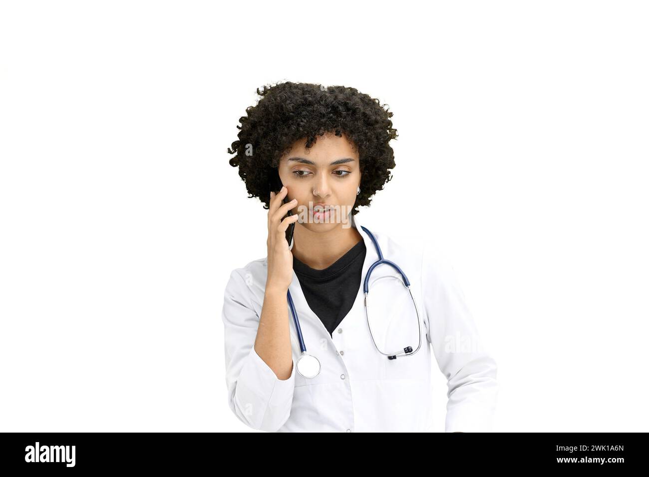 Female doctor, close-up, on a white background, with a phone Stock ...