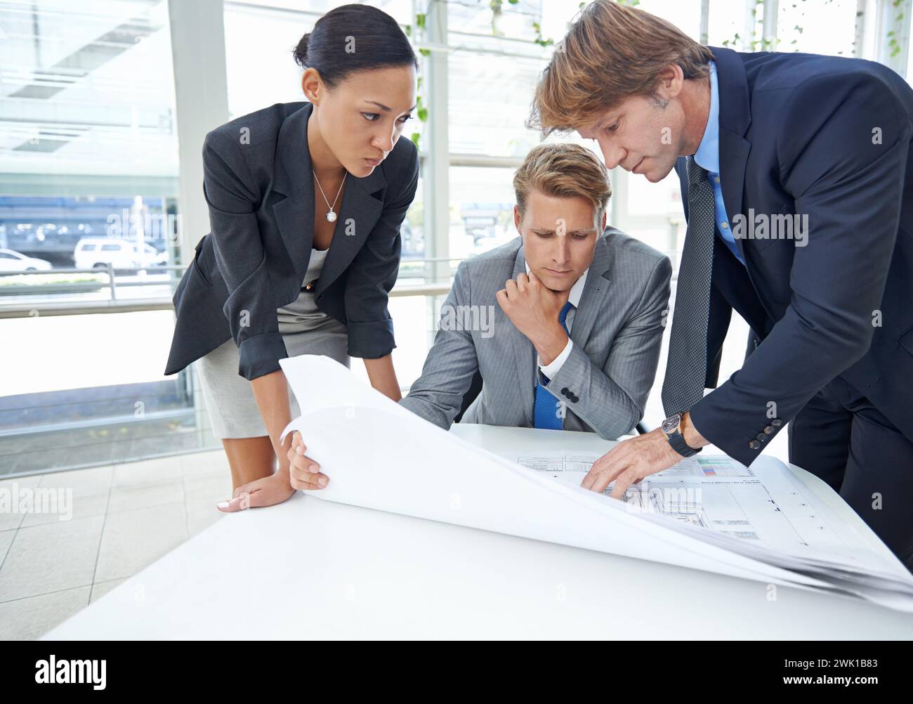 Architect, teamwork and blueprint or project planning in corporate ...