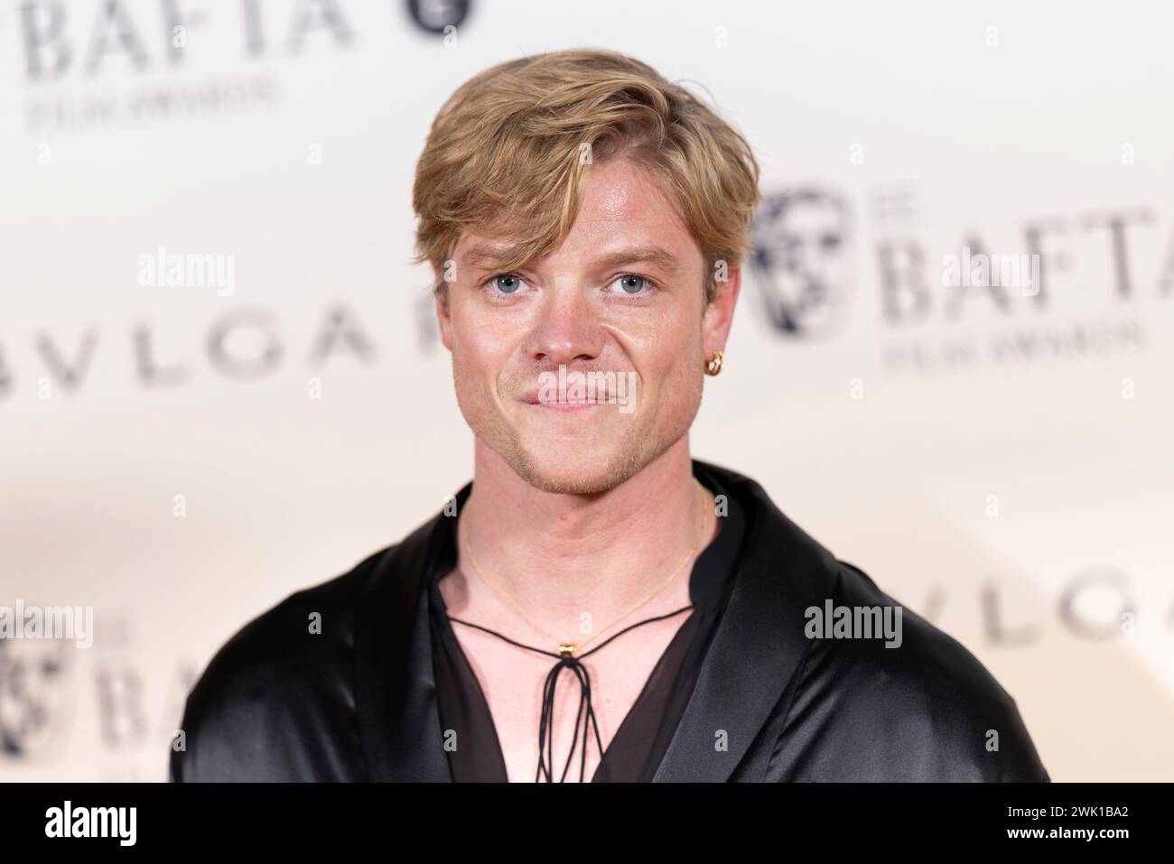 Tom Rhys Harries poses for photographers upon arrival for the BAFTA ...
