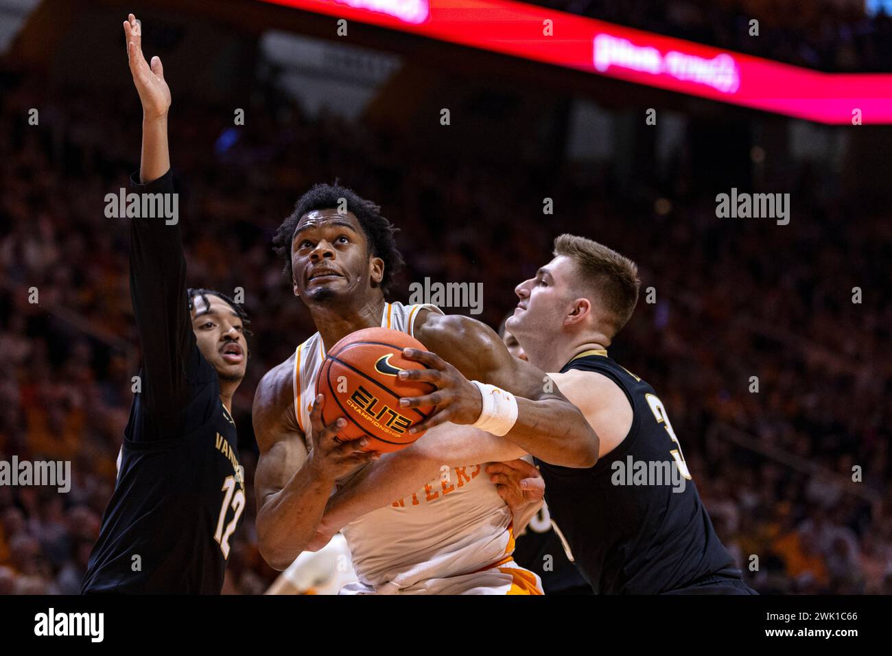 Tennessee forward Tobe Awaka drives for a shot between Vanderbilt guard ...
