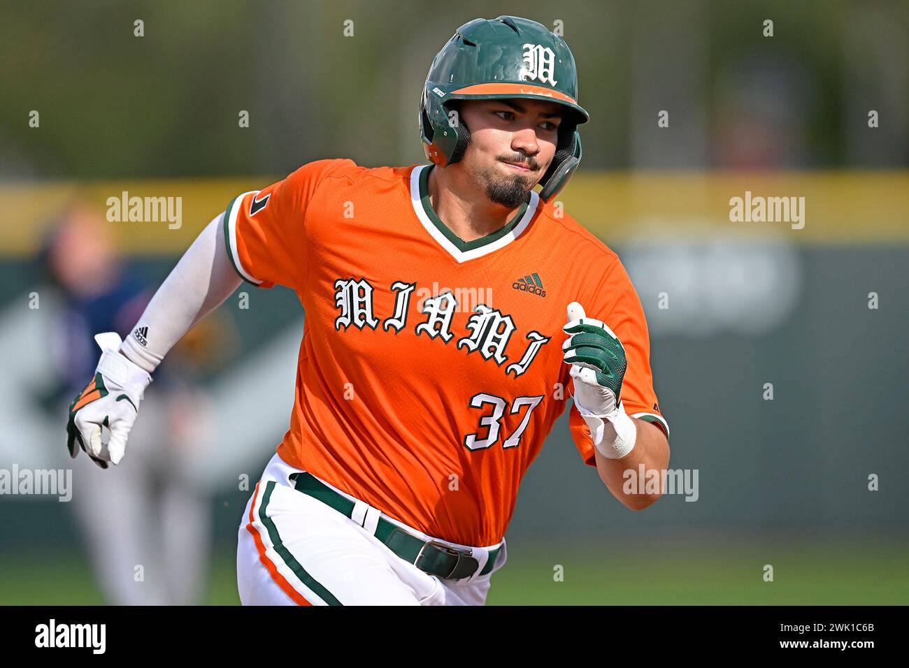 CORAL GABLES, FL - FEBRUARY 17: Miami infielder Jason Torres (37) runs ...