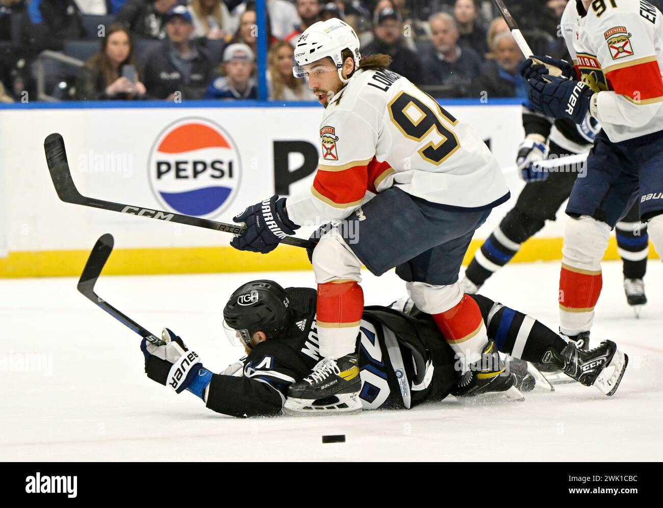 Florida Panthers left wing Ryan Lomberg (94) trips Tampa Bay Lightning ...