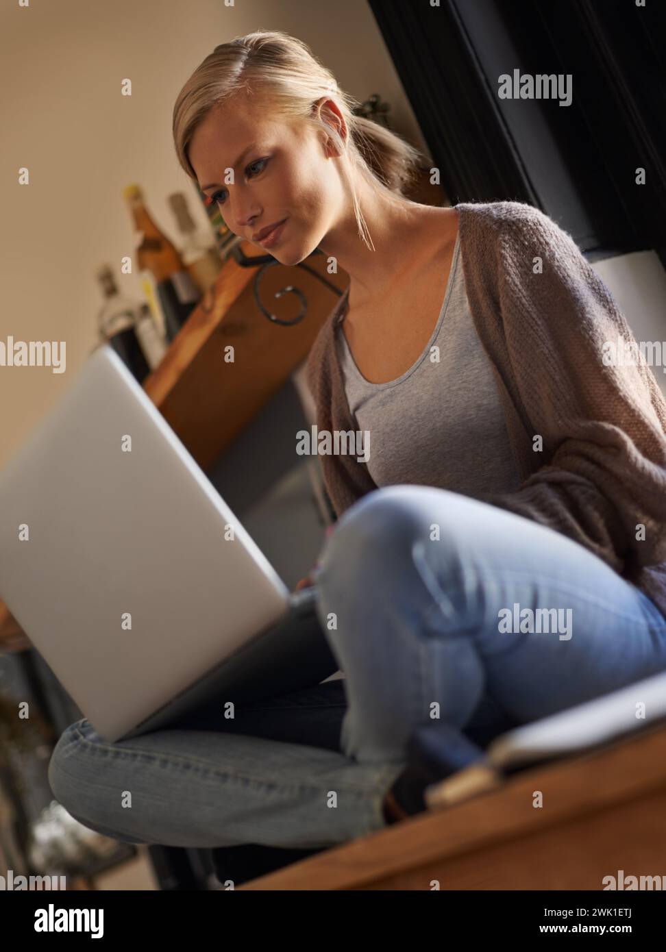 Laptop, search and woman relax in a house with social media, streaming ...