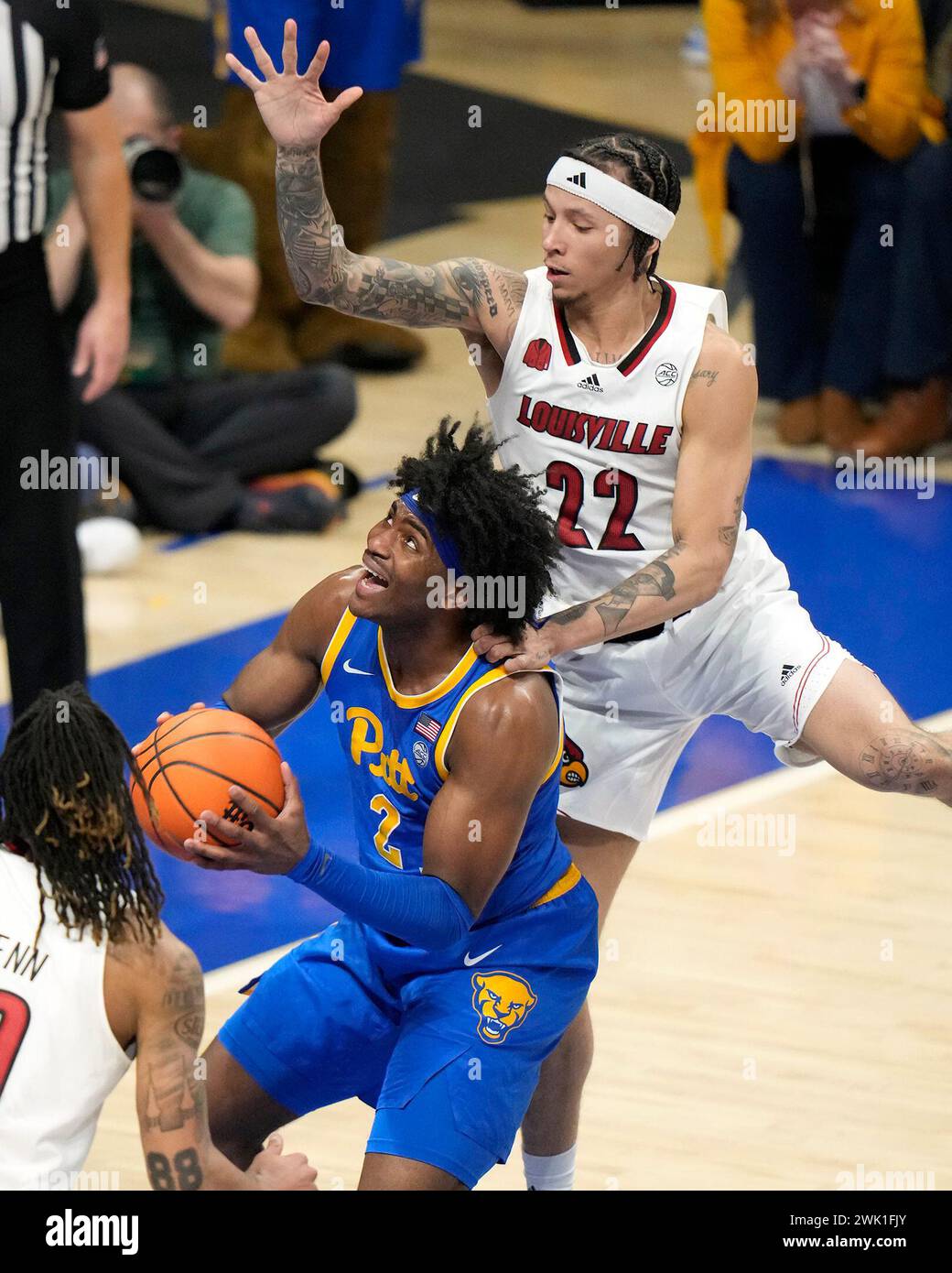 Pittsburgh's Blake Hinson (2) drives inside with Louisville's Tre White ...