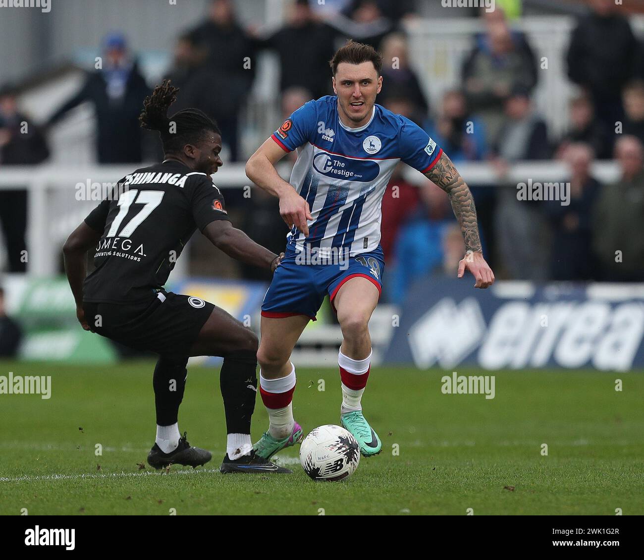 Callum Cooke of Hartlepool United in action with Borehamwood's Kabongo ...