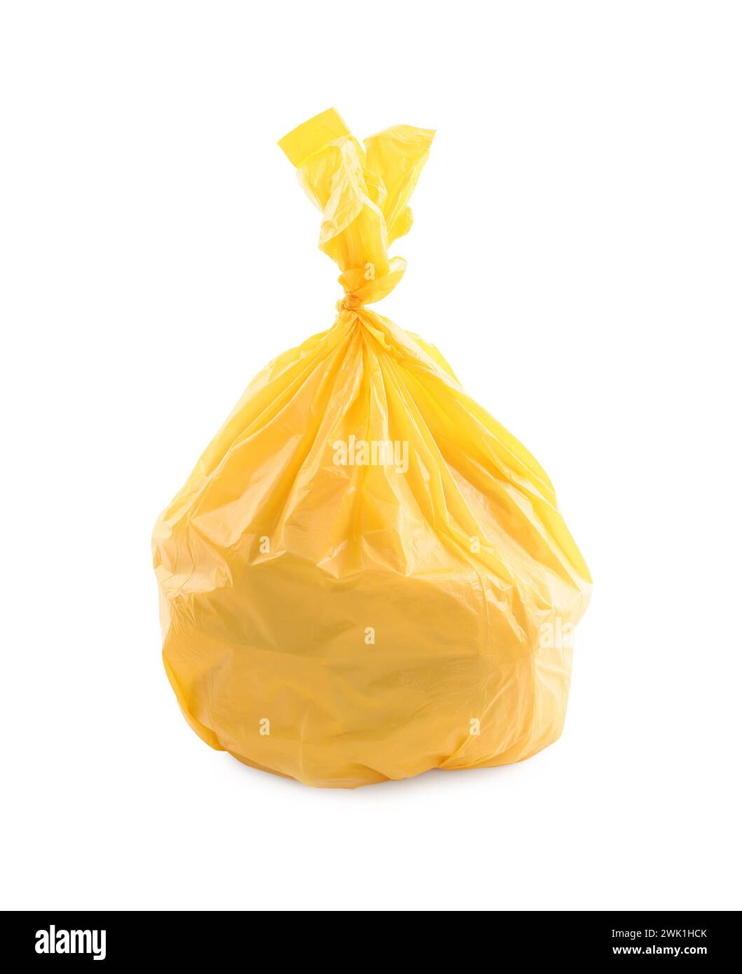 Yellow plastic garbage bag isolated on white Stock Photo - Alamy