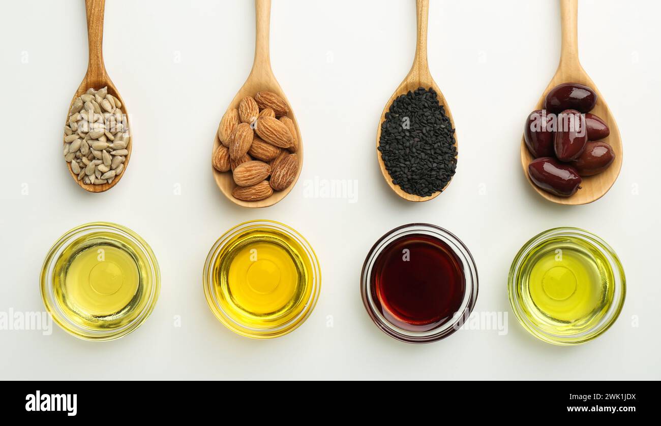 Vegetable fats. Different cooking oils in bowls and spoons with ...