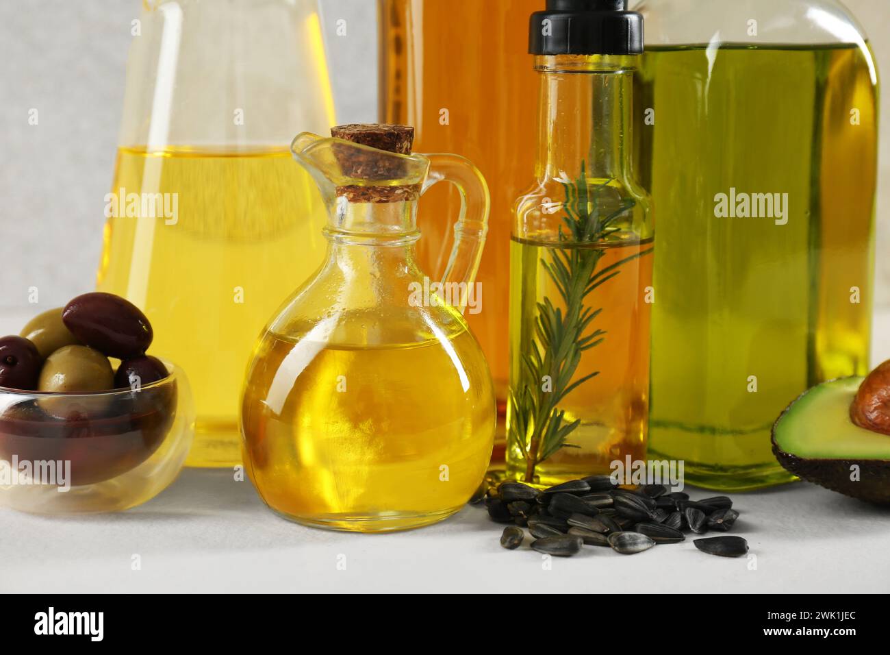 Vegetable fats. Different cooking oils in glass bottles and ingredients ...
