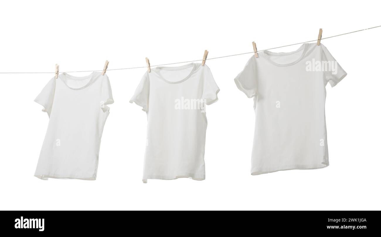 Many t-shirts drying on washing line isolated on white Stock Photo - Alamy