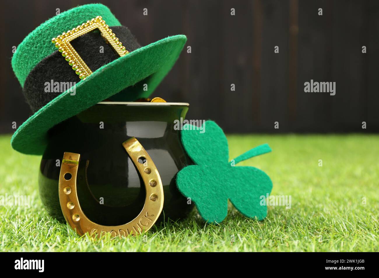 St. Patrick's day. Pot of gold with leprechaun hat, horseshoe and ...