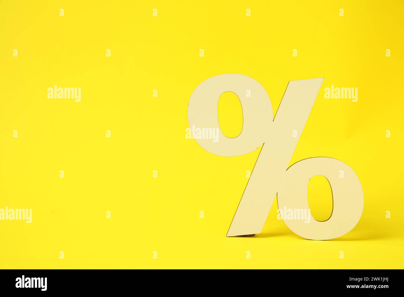 Wooden percent sign on yellow background. Space for text Stock Photo ...