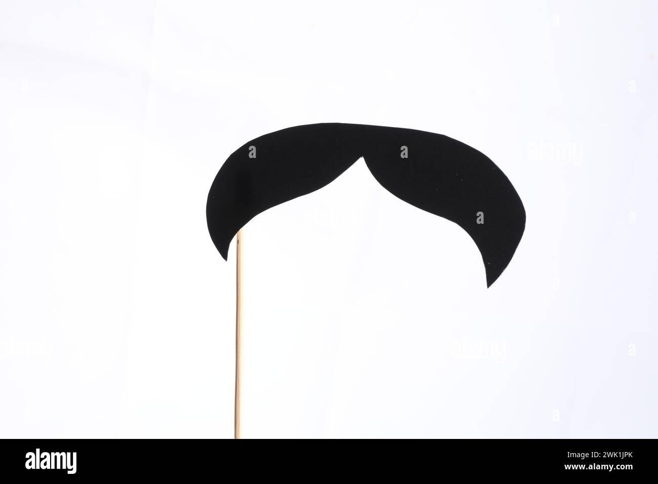 Fake paper mustache party prop against white background Stock Photo - Alamy